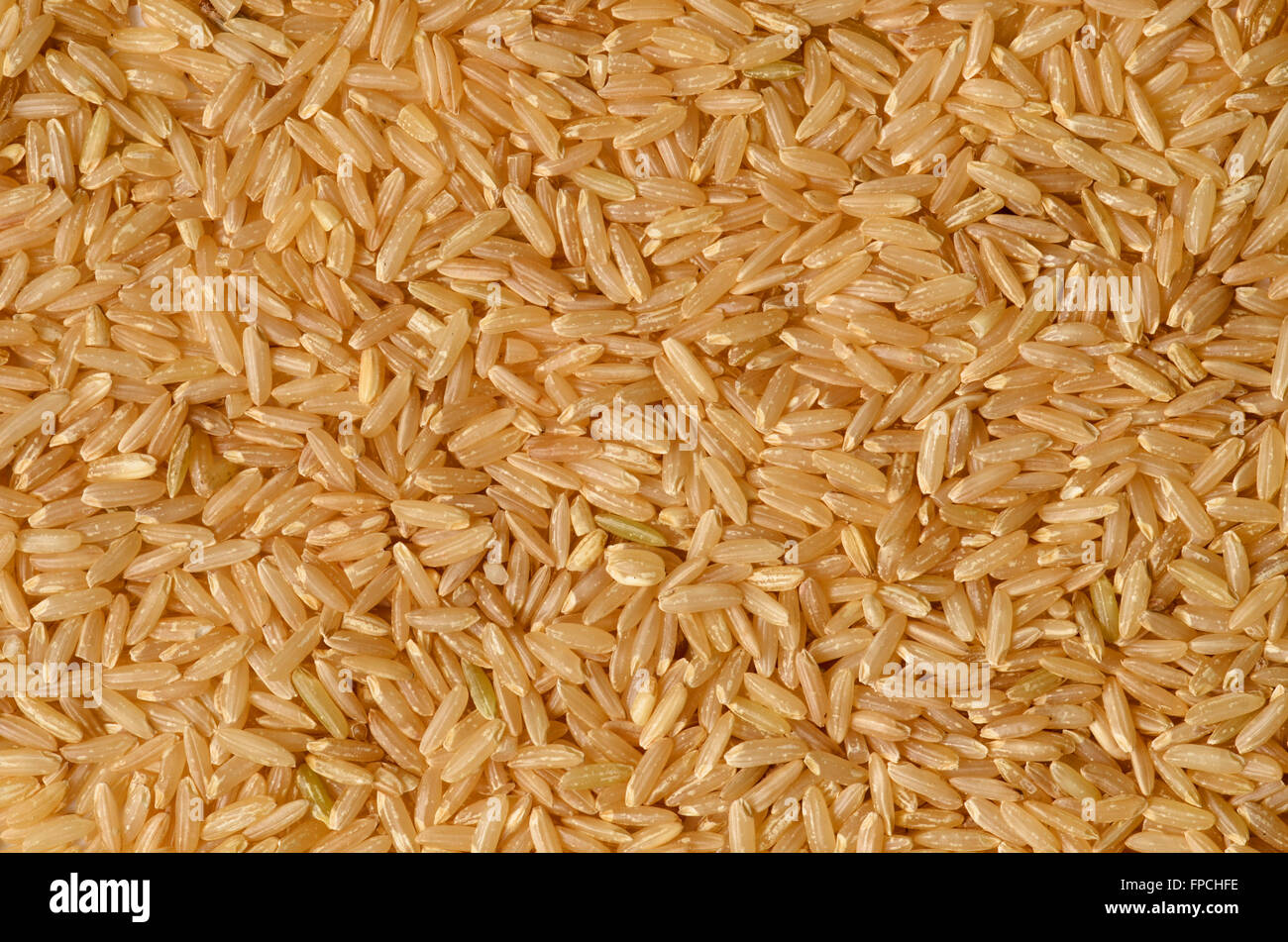 Healthy brown rice uncooked, close up shot Stock Photo - Alamy