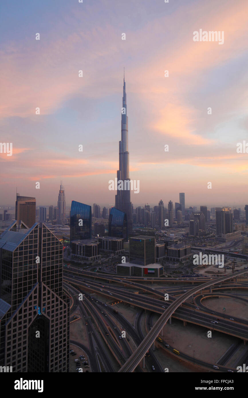 The BK, Burj Khalifa tower at sunset, and smaller towers. Designed by ...
