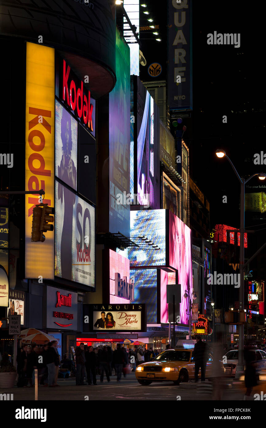 A view of Times Square in New York at night time, the bright lights ...