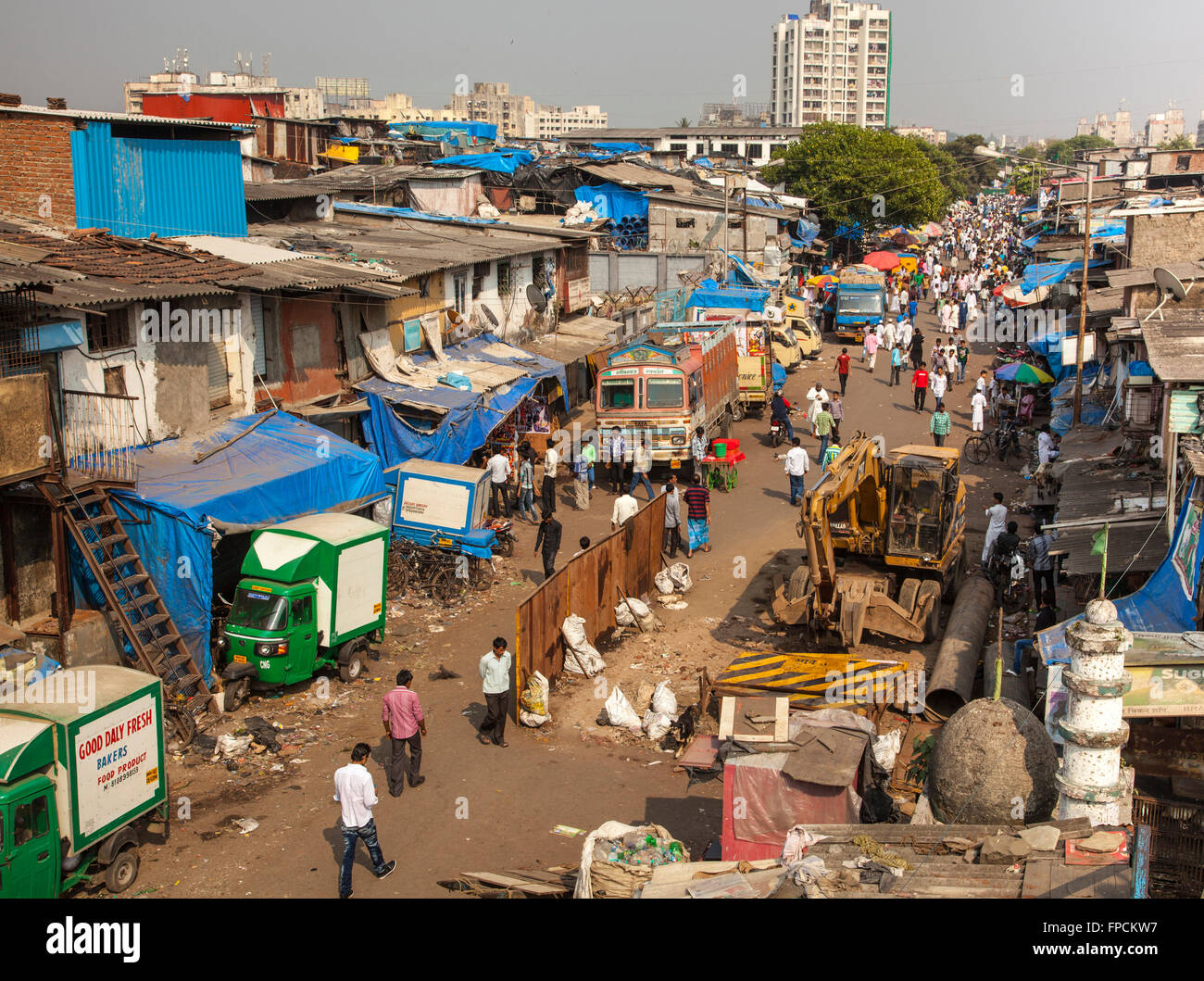 A view from above of a slum in Mumbai in India. People can be seen ...