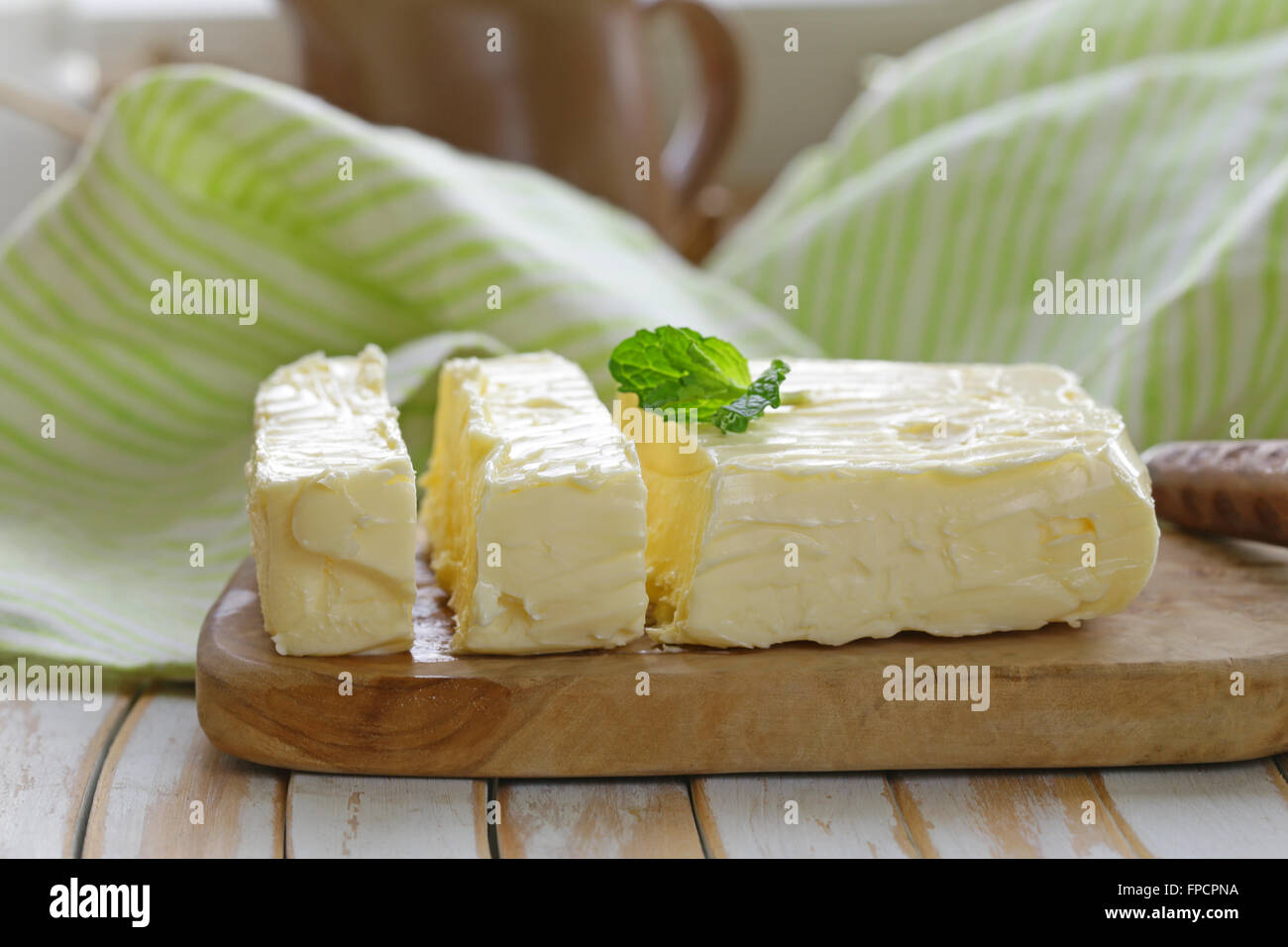 block of fresh organic butter on a wooden board Stock Photo - Alamy