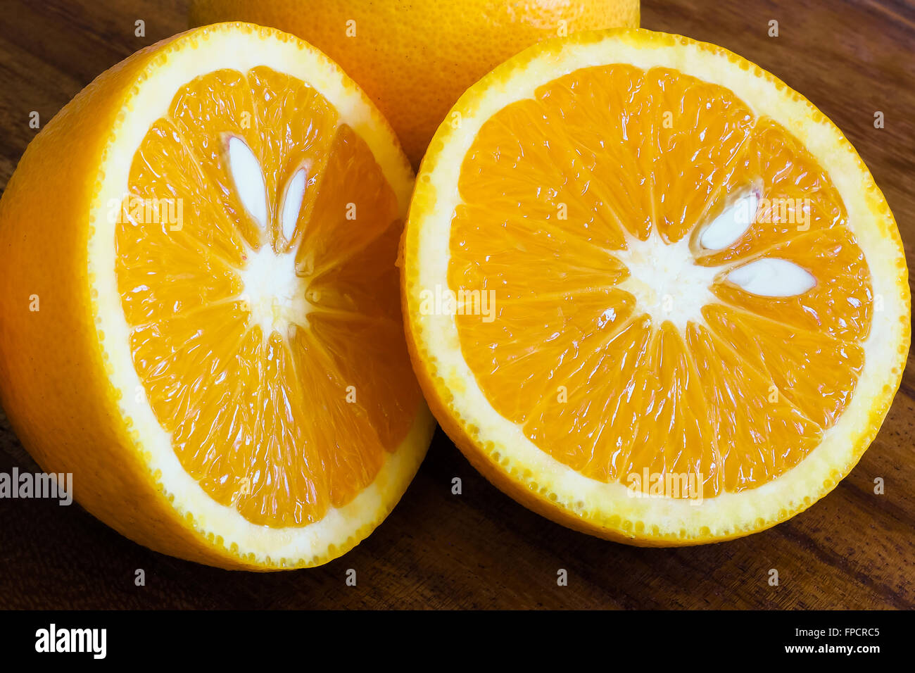 Orange fruit cut in half hi-res stock photography and images - Alamy