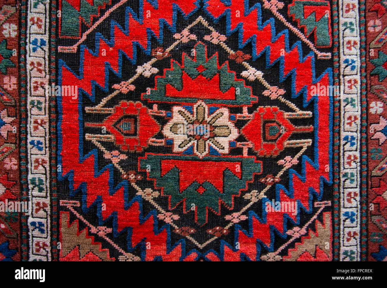 Armenian colorful hand made rug with traditional patterns and ornaments ...