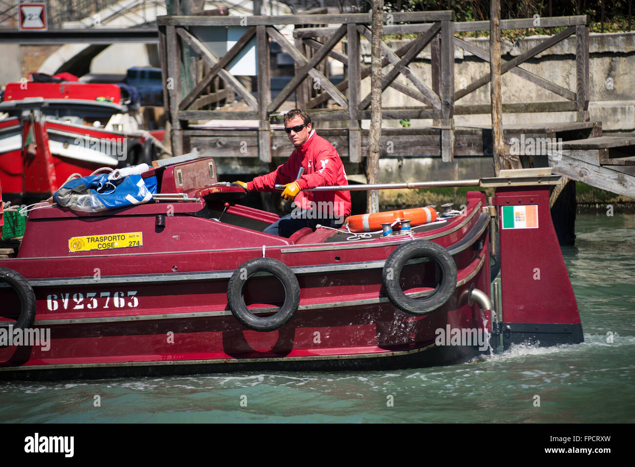 Portrait of a skipper of a barge on the Grand Canal in Venice on a ...