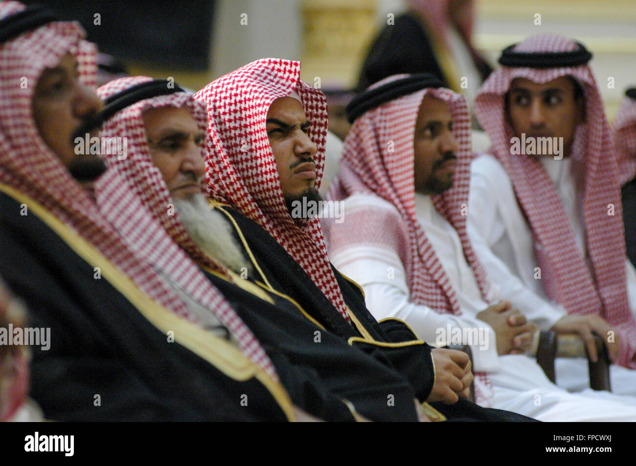 Saudi men listening to a speech Stock Photo - Alamy