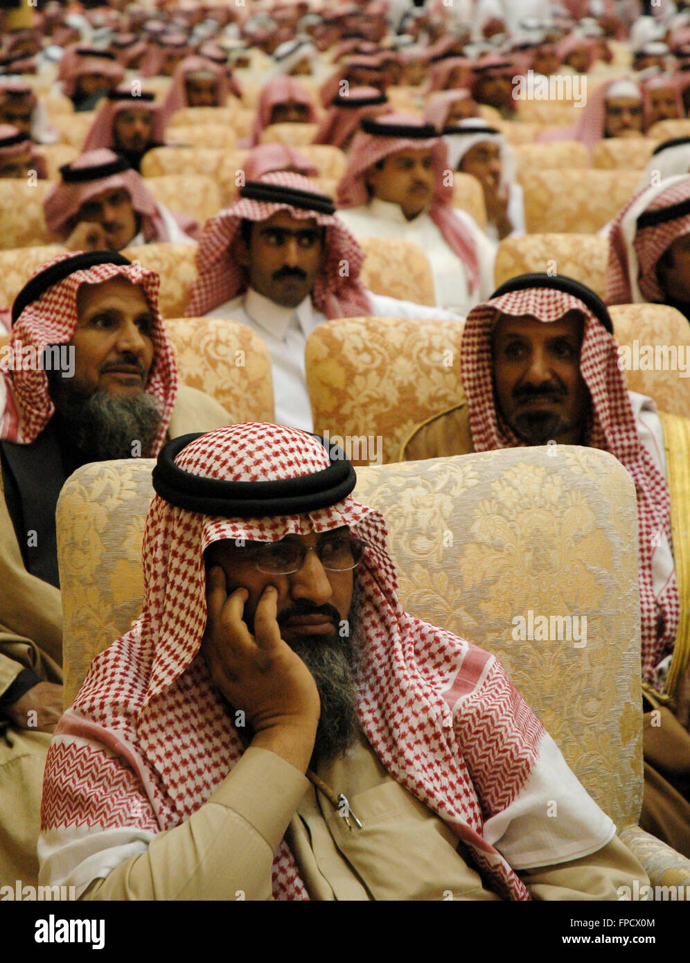 Saudi men listening to a speech Stock Photo - Alamy