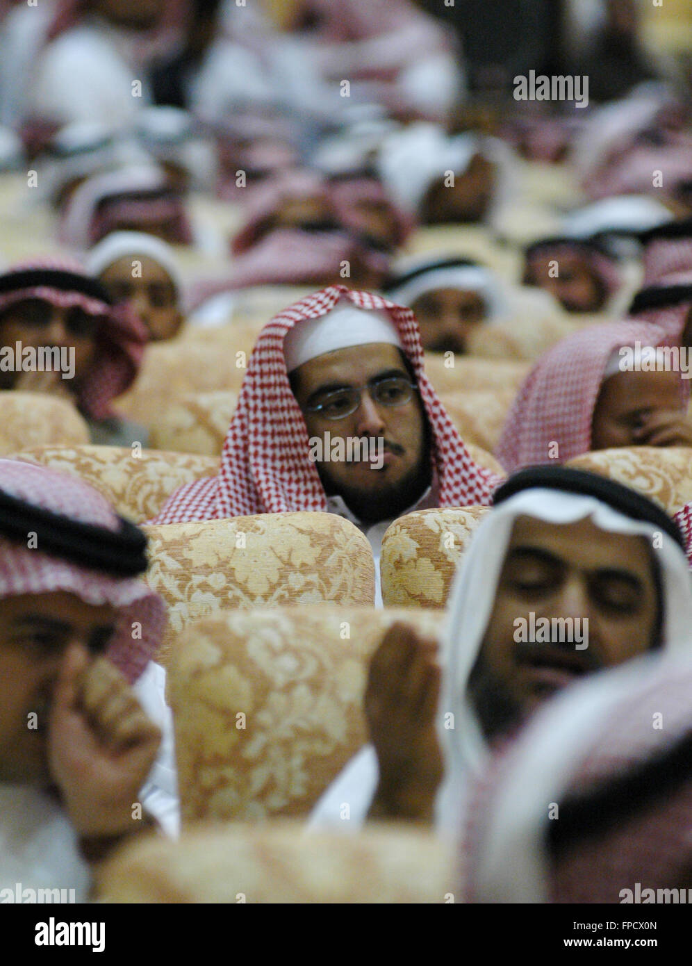 Saudi men listening to a speech Stock Photo - Alamy