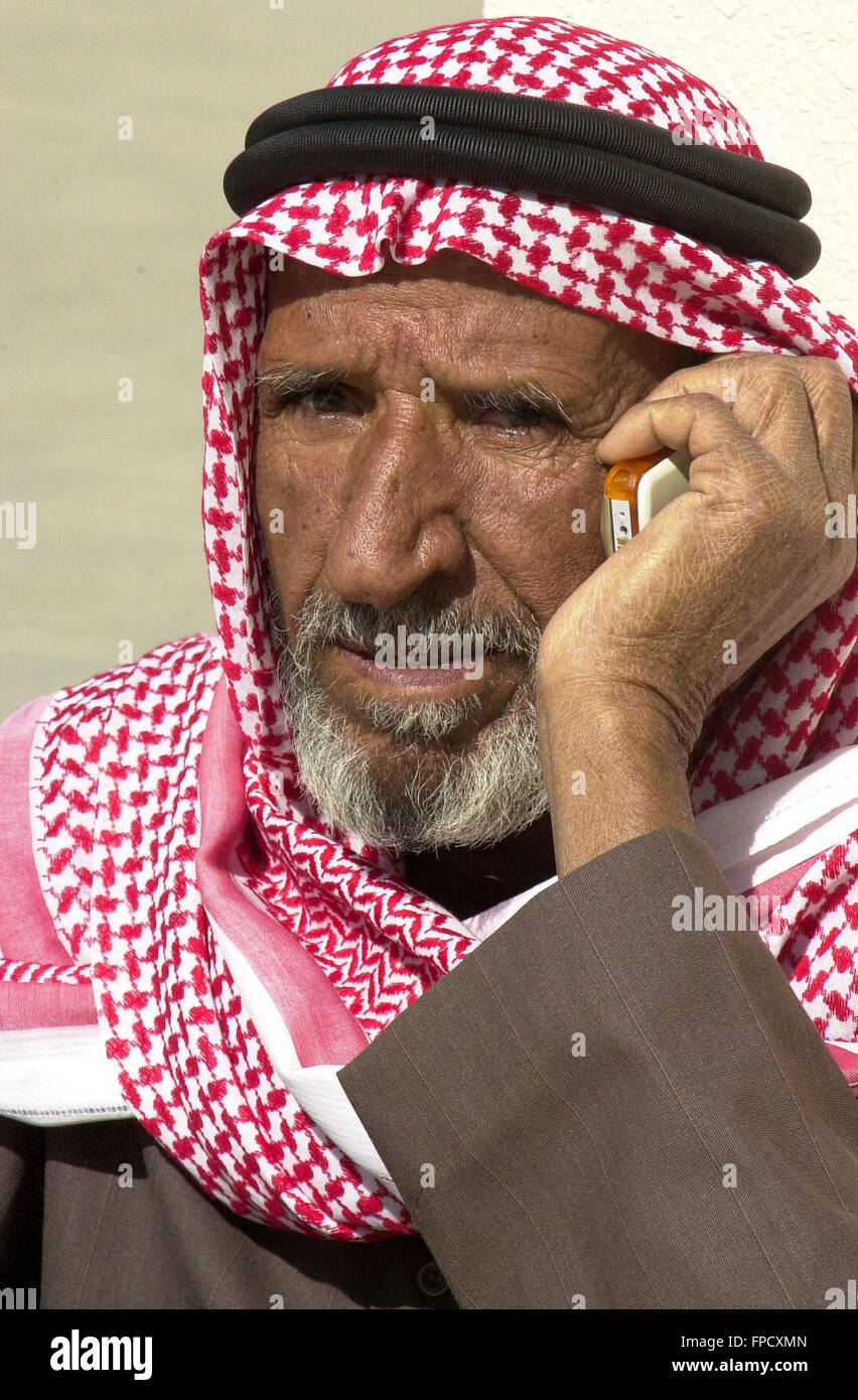 An elderly Saudi man talking on mobile phone Stock Photo - Alamy