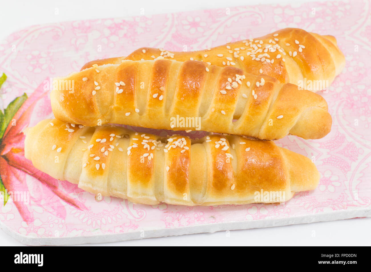 bunch of sesame pastry on a pink napkin Stock Photo - Alamy