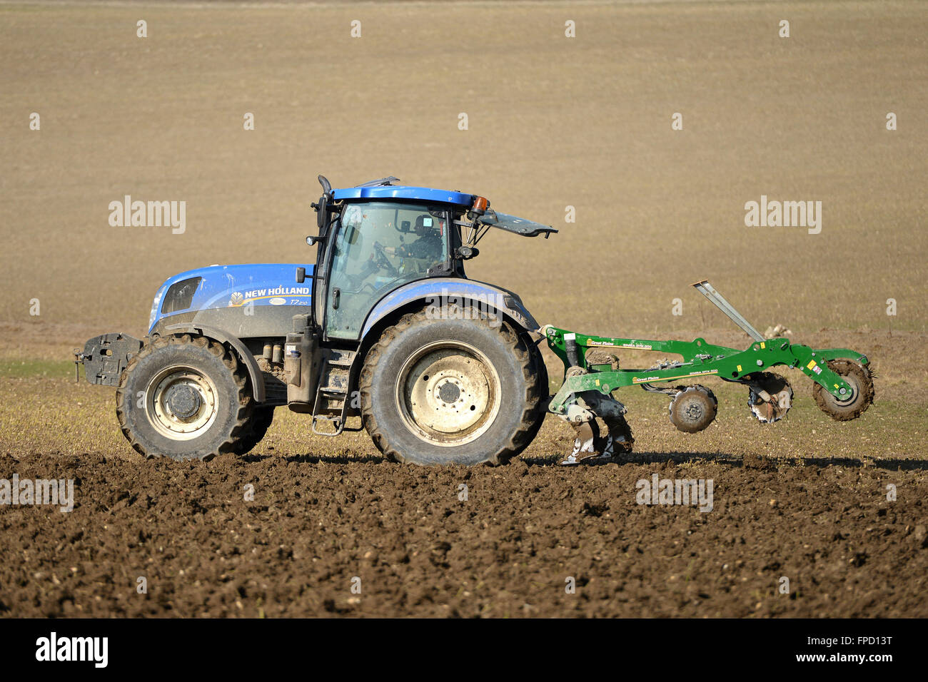 Tractor and plough Stock Photo - Alamy