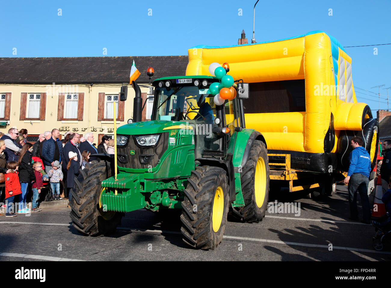 Tractor pulling bouncy castle in Carrickmacross St Patricks Day Parade ...