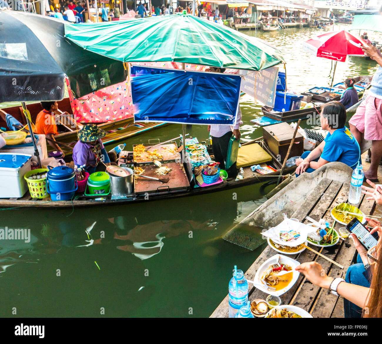 Trader's boats in a floating market in Thailand Stock Photo - Alamy