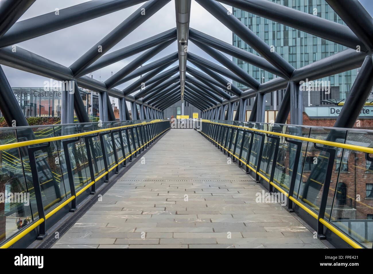 Pedestrian overhead footbridge between Deansgate trains station and ...