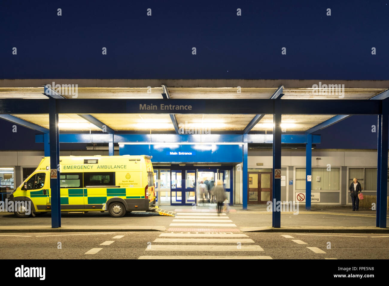 Entrance to the Royal Preston Hospital at night with ambulance parked ...