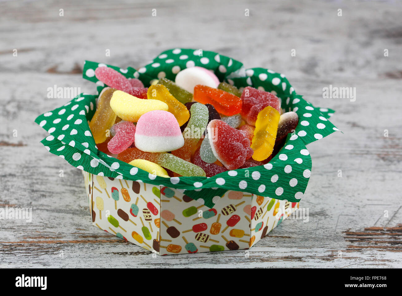 Sweet candies in a paper box, for packaging Stock Photo - Alamy