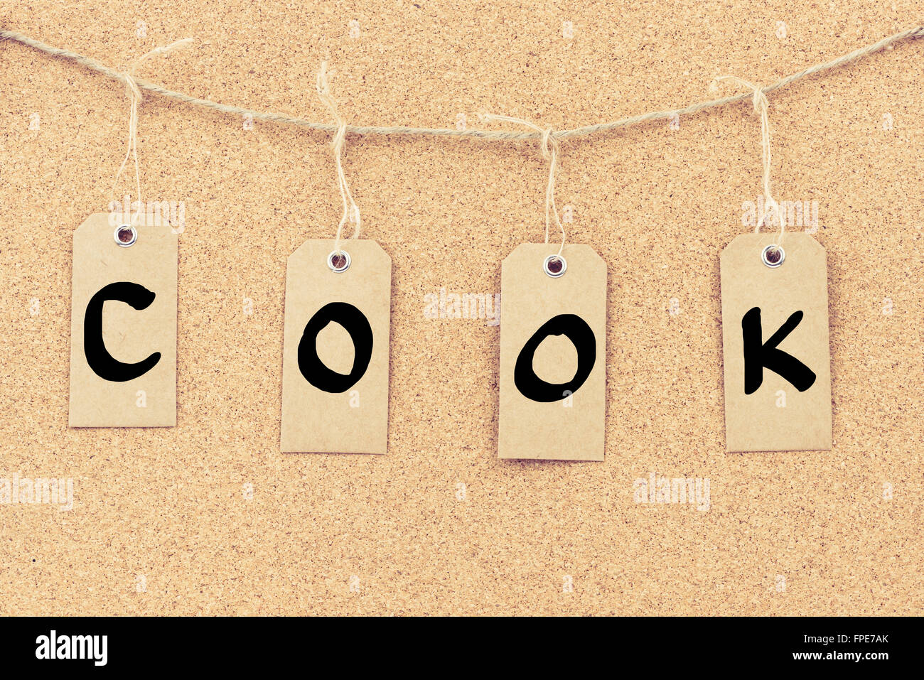 Vintage grunge tags with letters on rope string, word COOK over cork ...