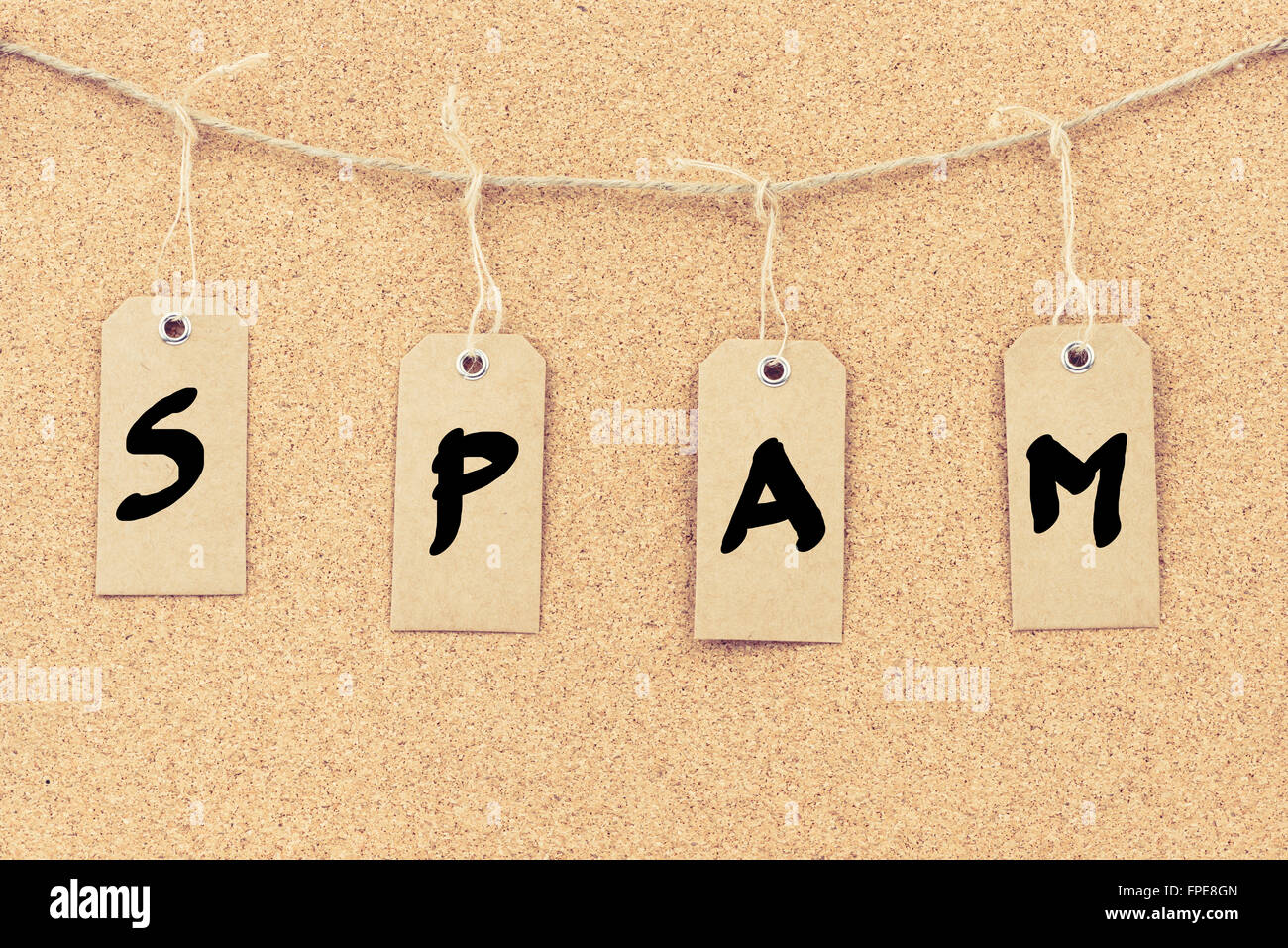 Vintage grunge tags with letters on rope string, word SPAM over cork ...