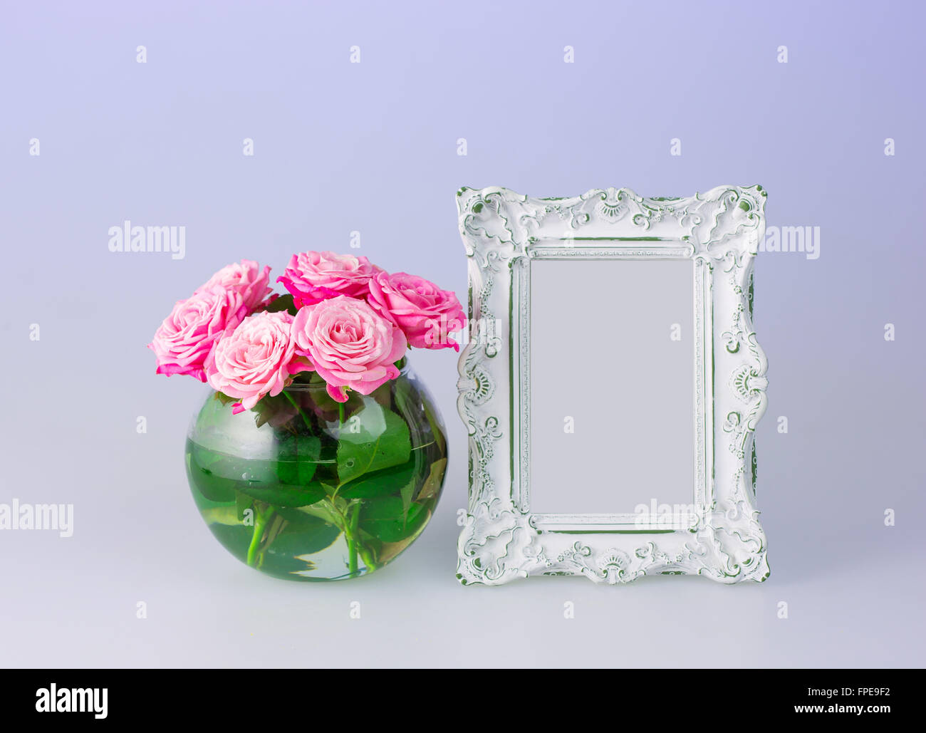 Flowers vase and vintage frame Stock Photo - Alamy