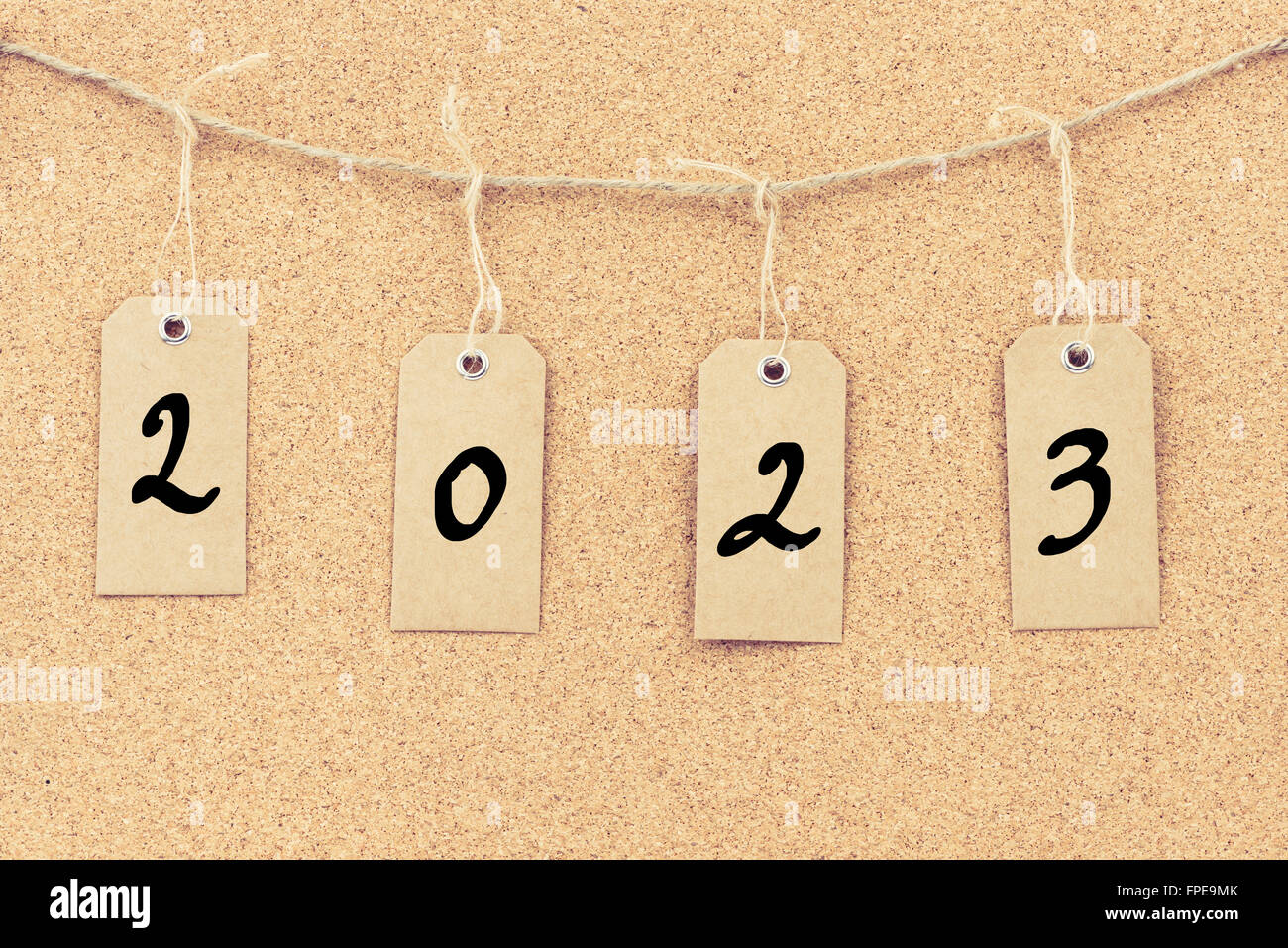 Vintage grunge tags with letters on rope string, YEAR 2023 over cork ...
