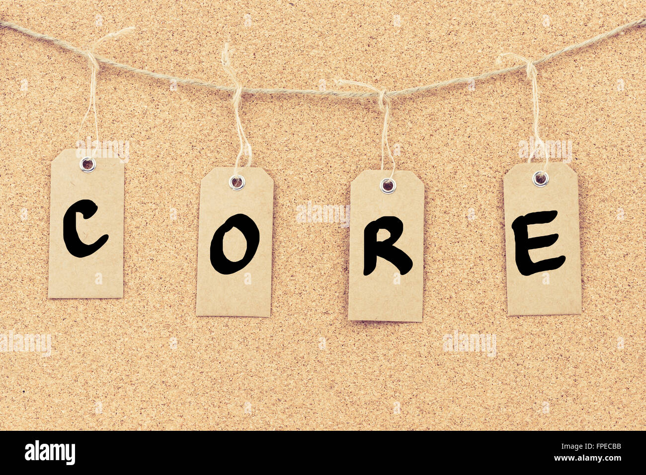 Vintage grunge tags with letters on rope string, word CORE over cork ...