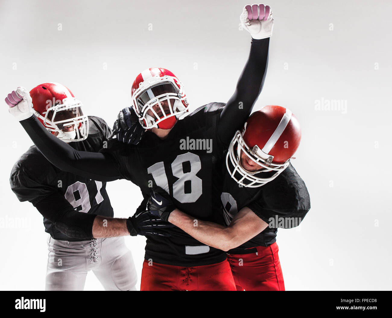 The three caucasian fitness men as american football players posing as ...