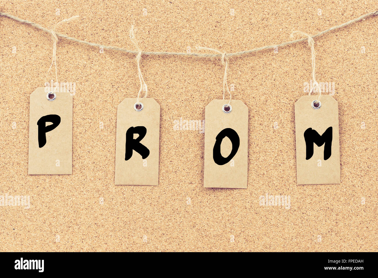 Vintage grunge tags with letters on rope string, word PROM over cork ...