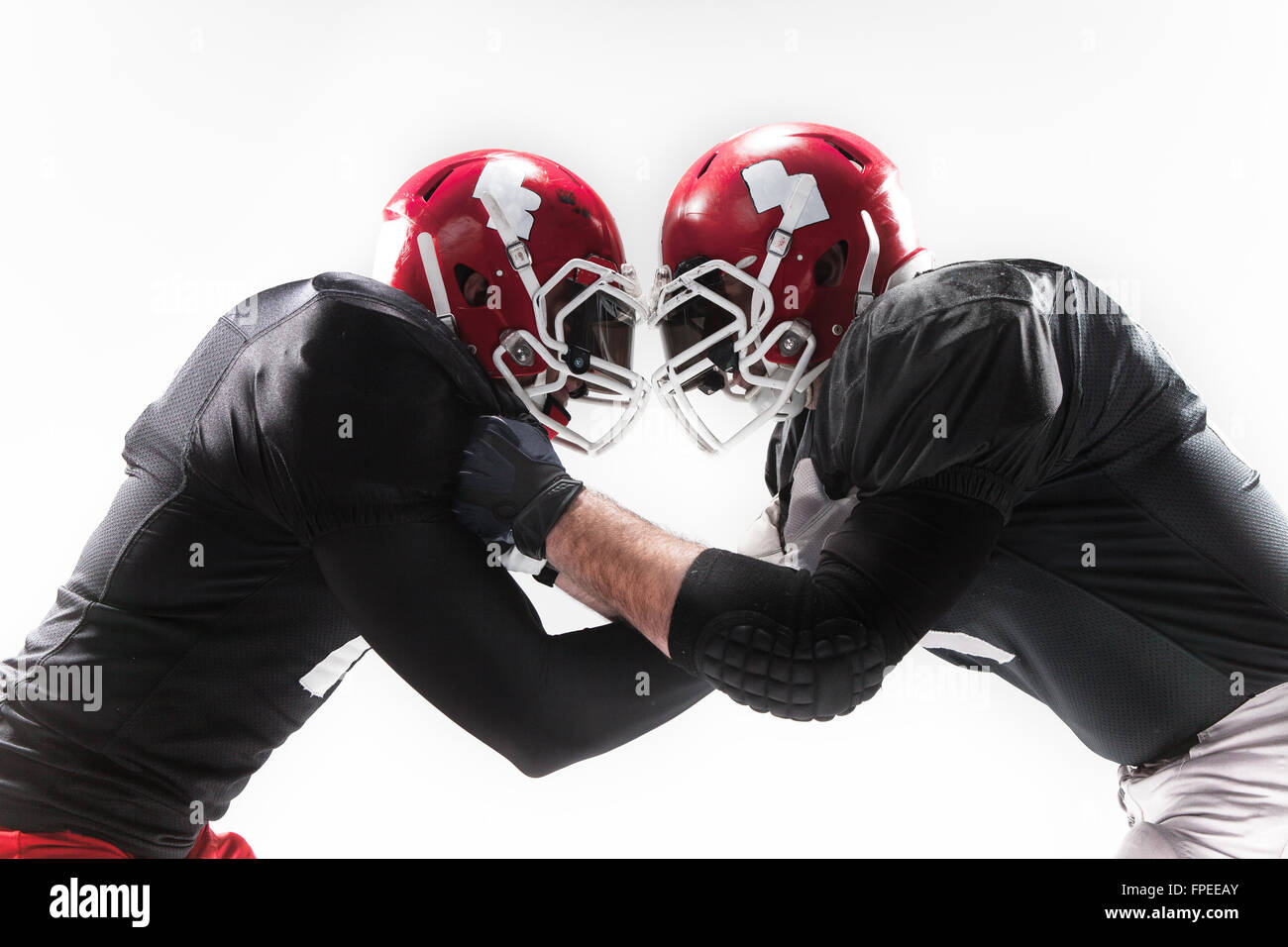 The two fitness men as american football players fighting on white ...