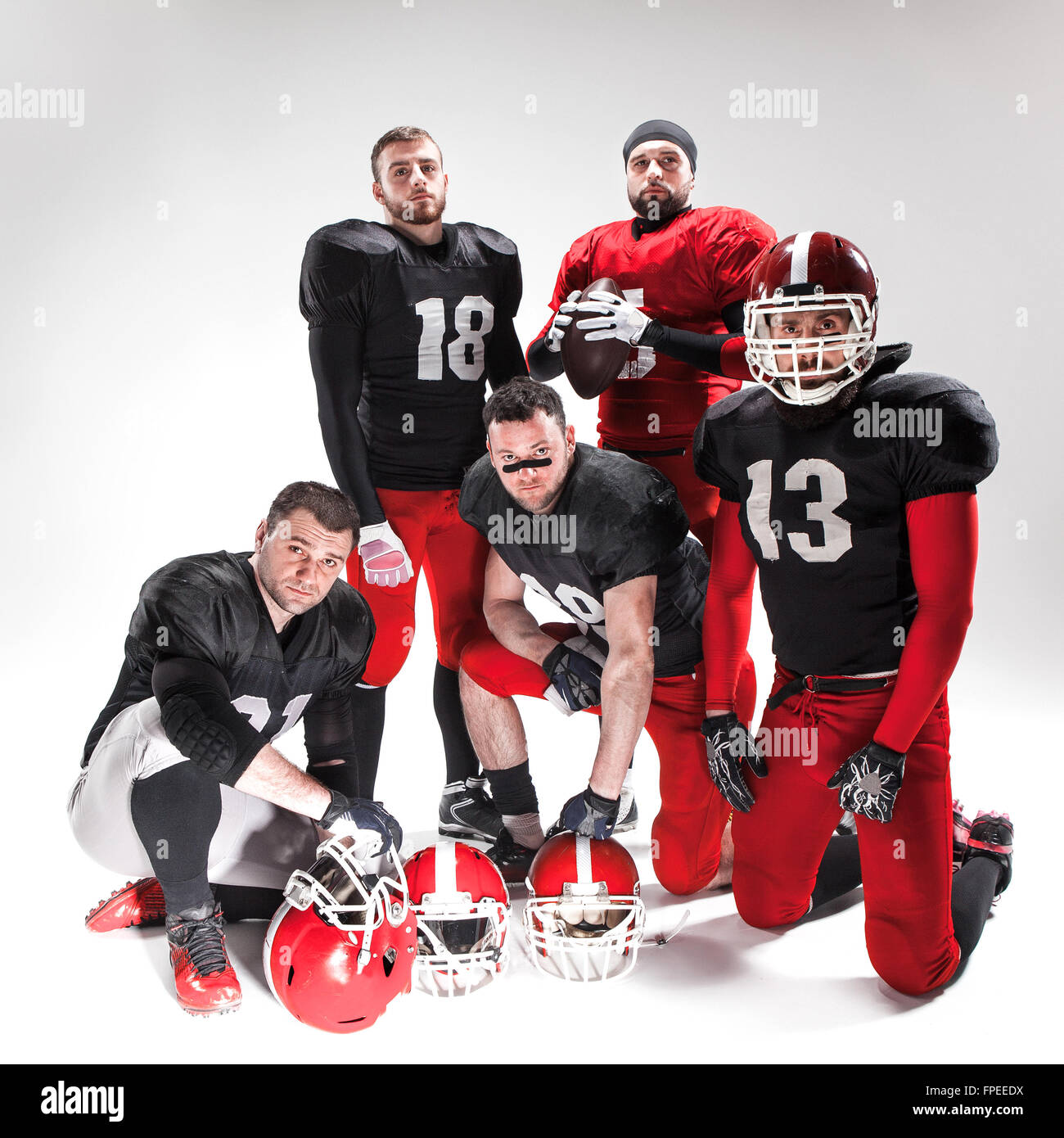 The five caucasian fitness men as american football players posing full ...