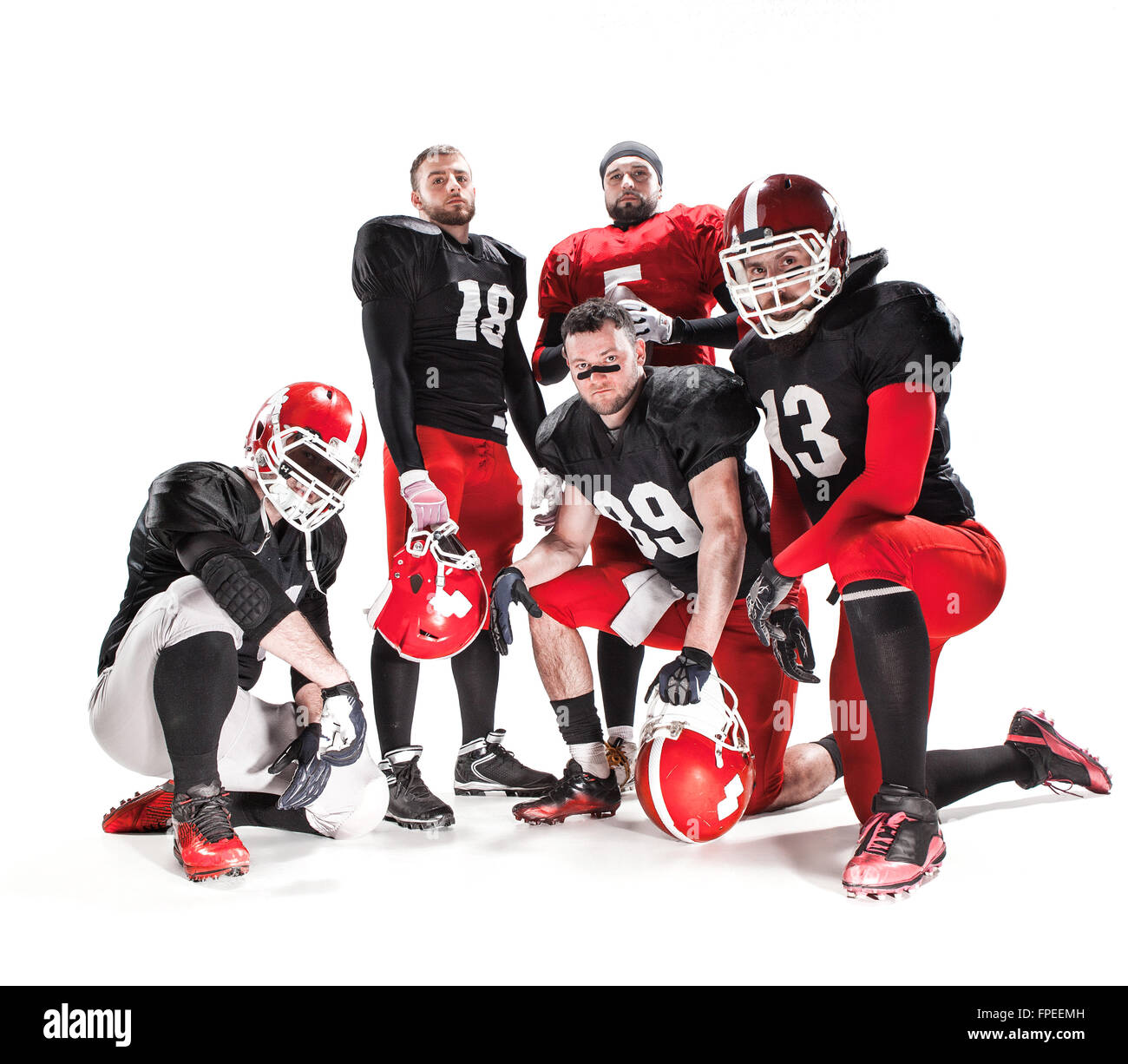 The five caucasian fitness men as american football players posing full ...