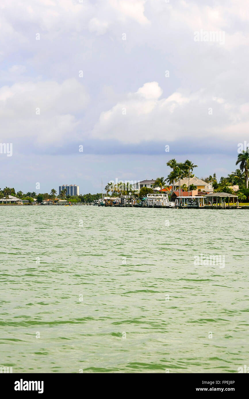 Homes on the edge of Naples Bay in Florida Stock Photo - Alamy