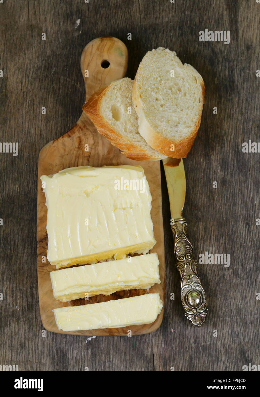block of fresh organic butter on a wooden board Stock Photo - Alamy