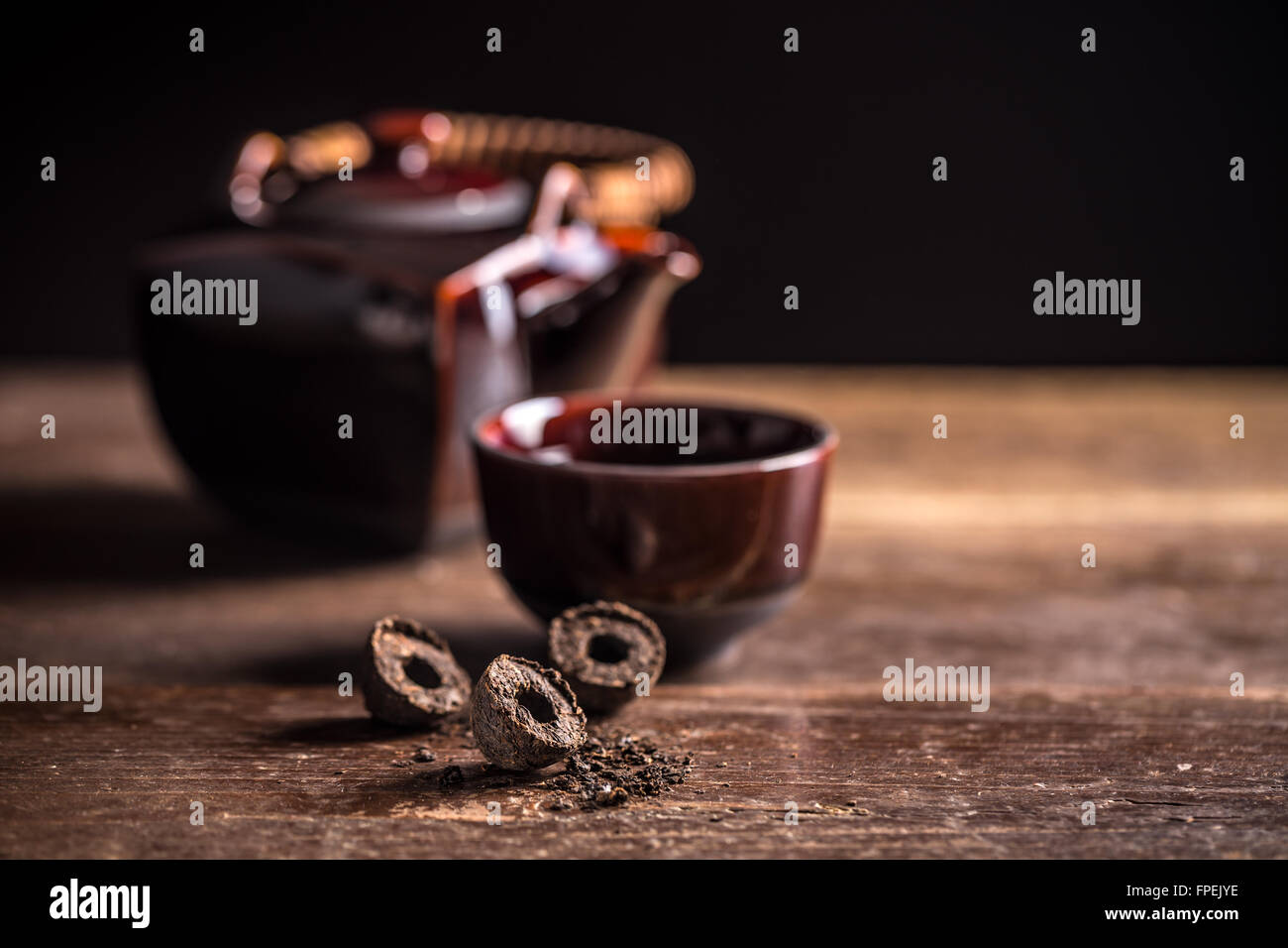Compressed pu-erh chinese tea on rustic wooden background Stock Photo ...