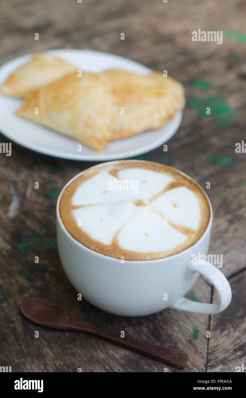 A cup of hot coffee and curry puff Stock Photo - Alamy