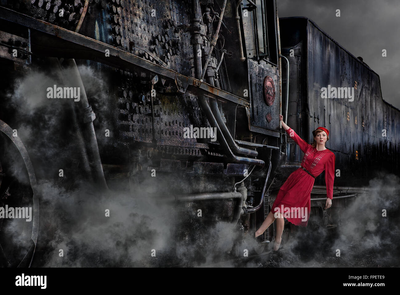 Girl in the red dress waiting by the steam train Stock Photo - Alamy