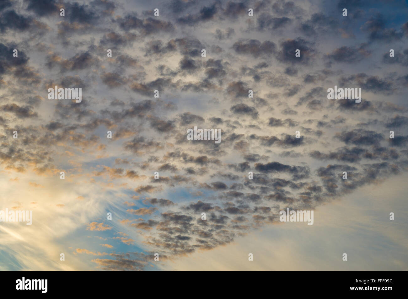 Different type of clouds on sunsrise sky Stock Photo - Alamy