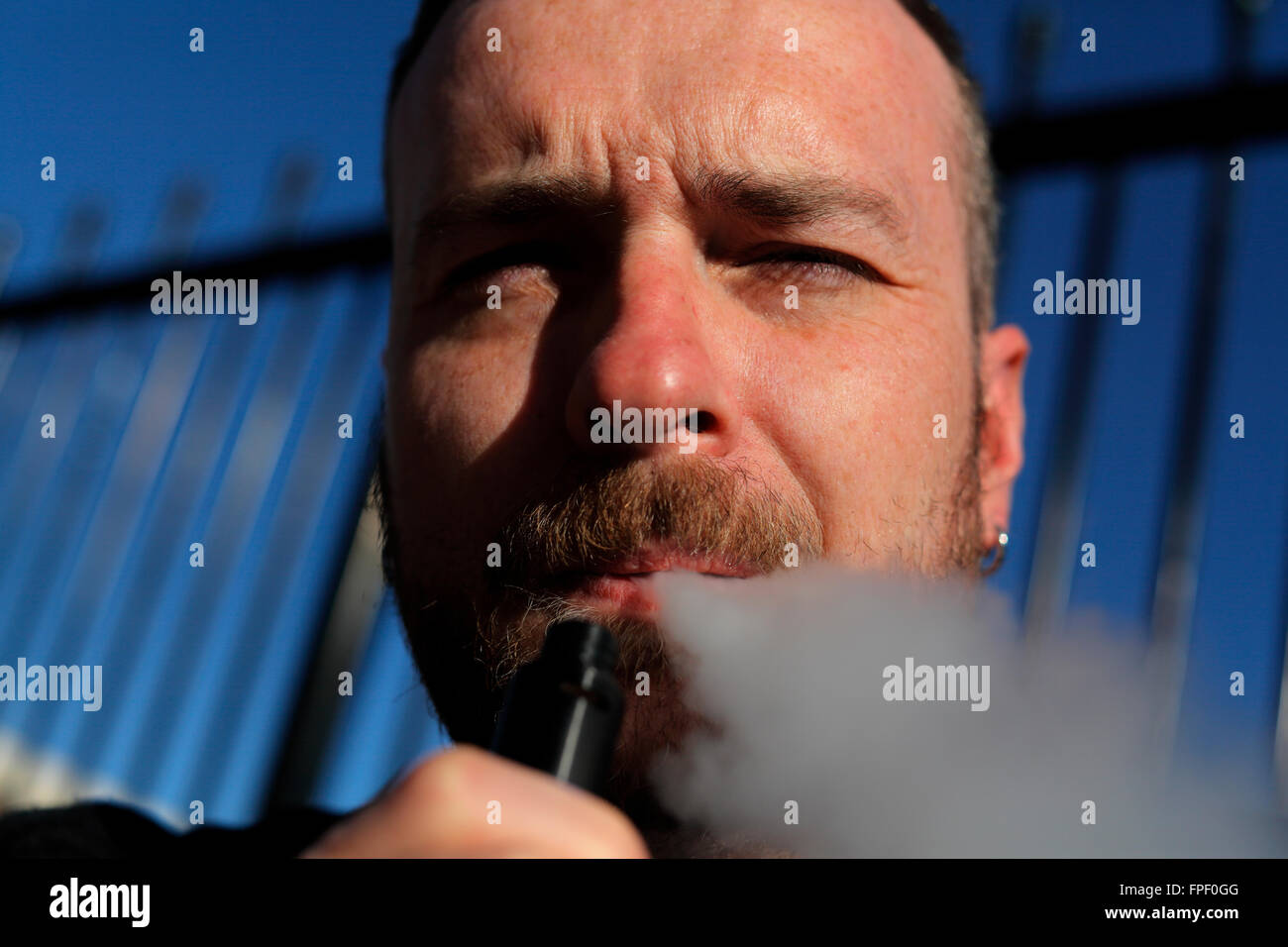 Man using electronic cigarette Stock Photo - Alamy