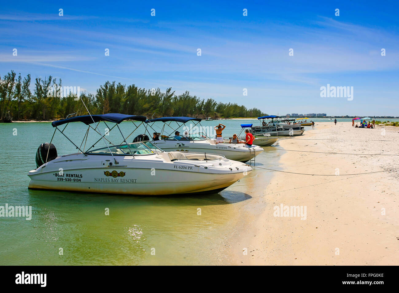 People and their boats having fun in the sun around Keewaydin Island ...