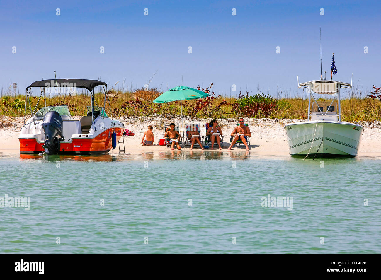 People and their boats having fun in the sun around Keewaydin Island ...