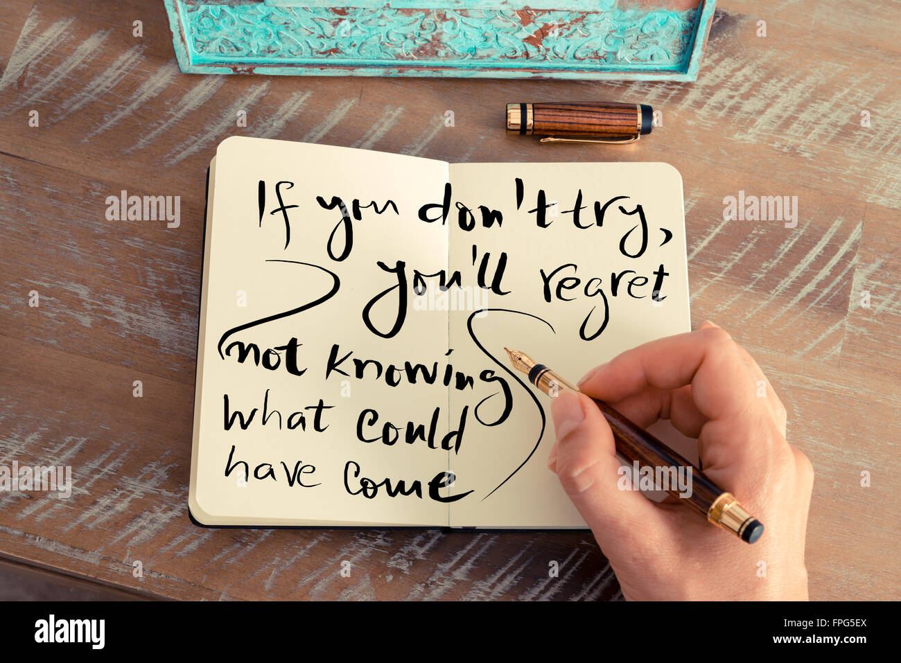 Retro effect and toned image of a woman hand writing a note with a ...