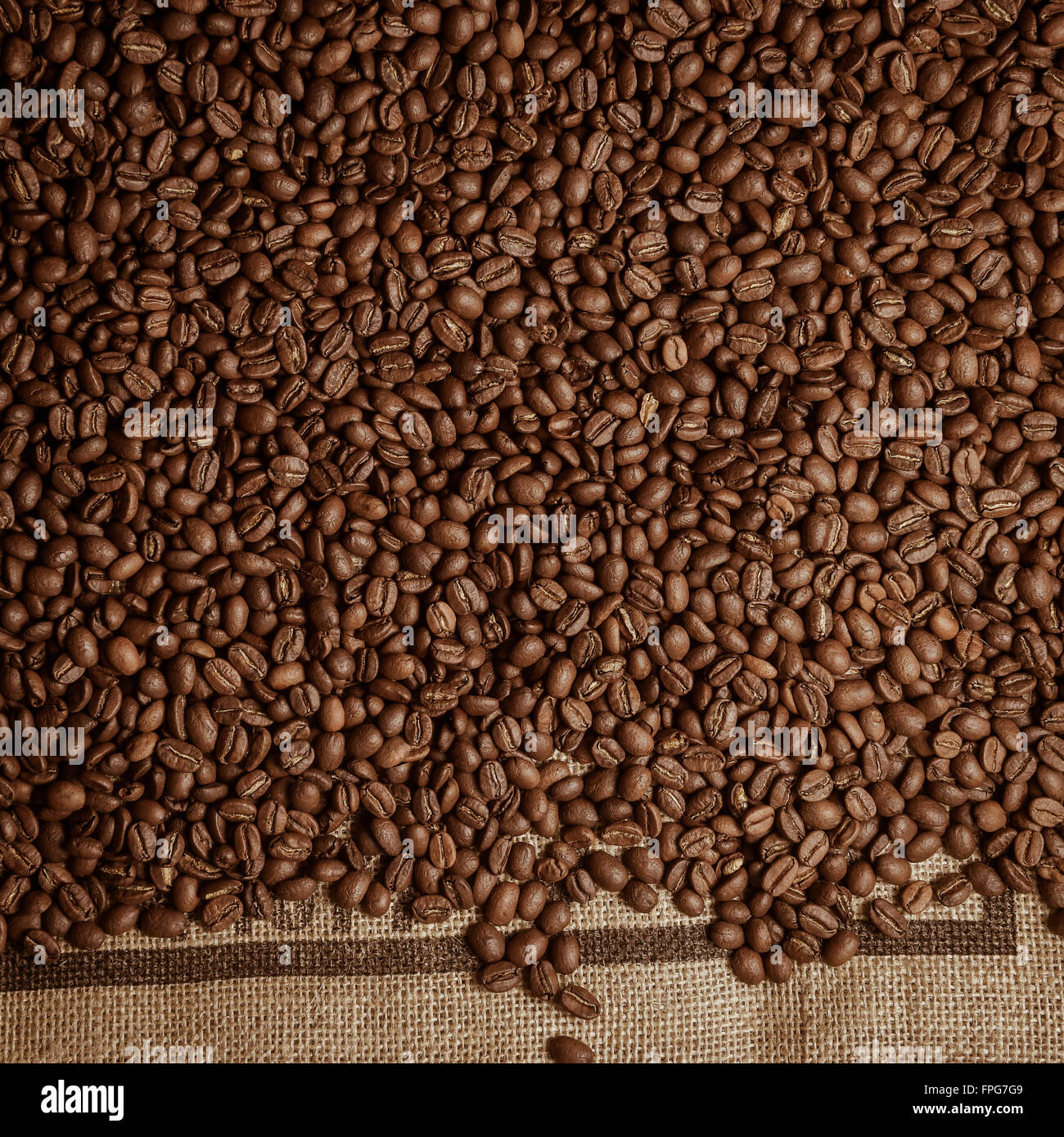 Coffee beans on jute bag Stock Photo - Alamy