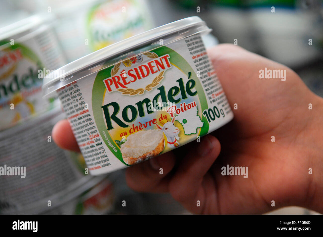 Rondele President spreadable cheese being purchased by shopper Stock ...
