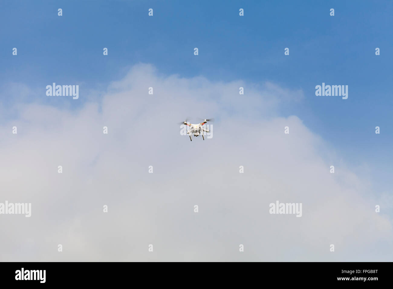 Quadcopter drone with camera flying in the sky Stock Photo - Alamy
