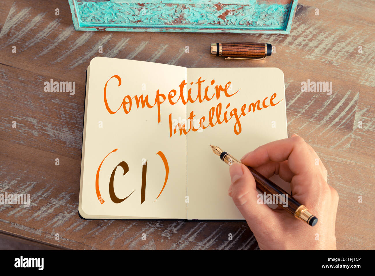 Handwritten text CI COMPETITIVE INTELLIGENCE, business success concept ...