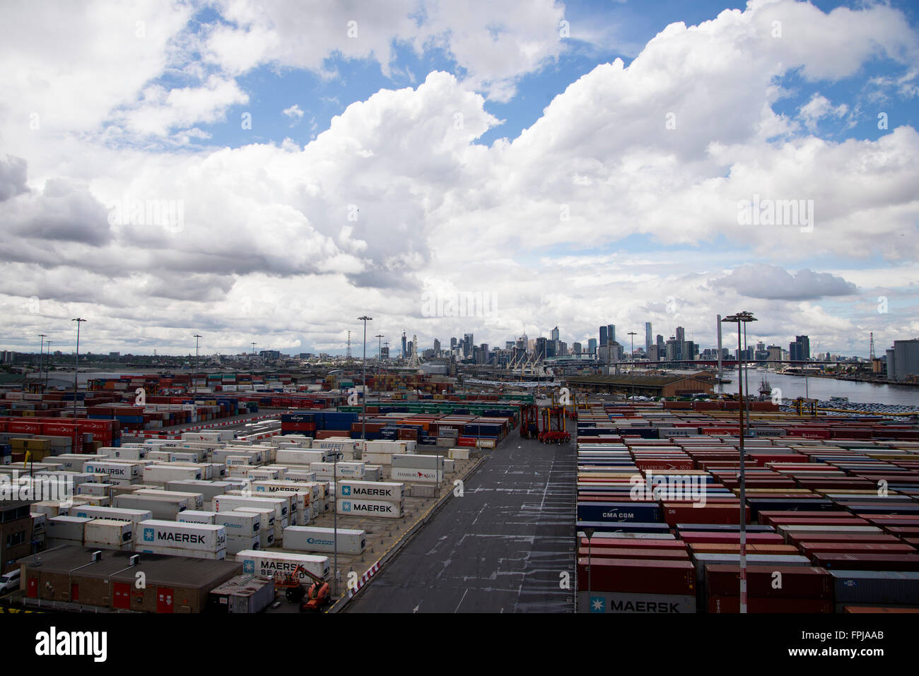 lines of containers stacked on a rainy wet day in Port of Melbourne ...