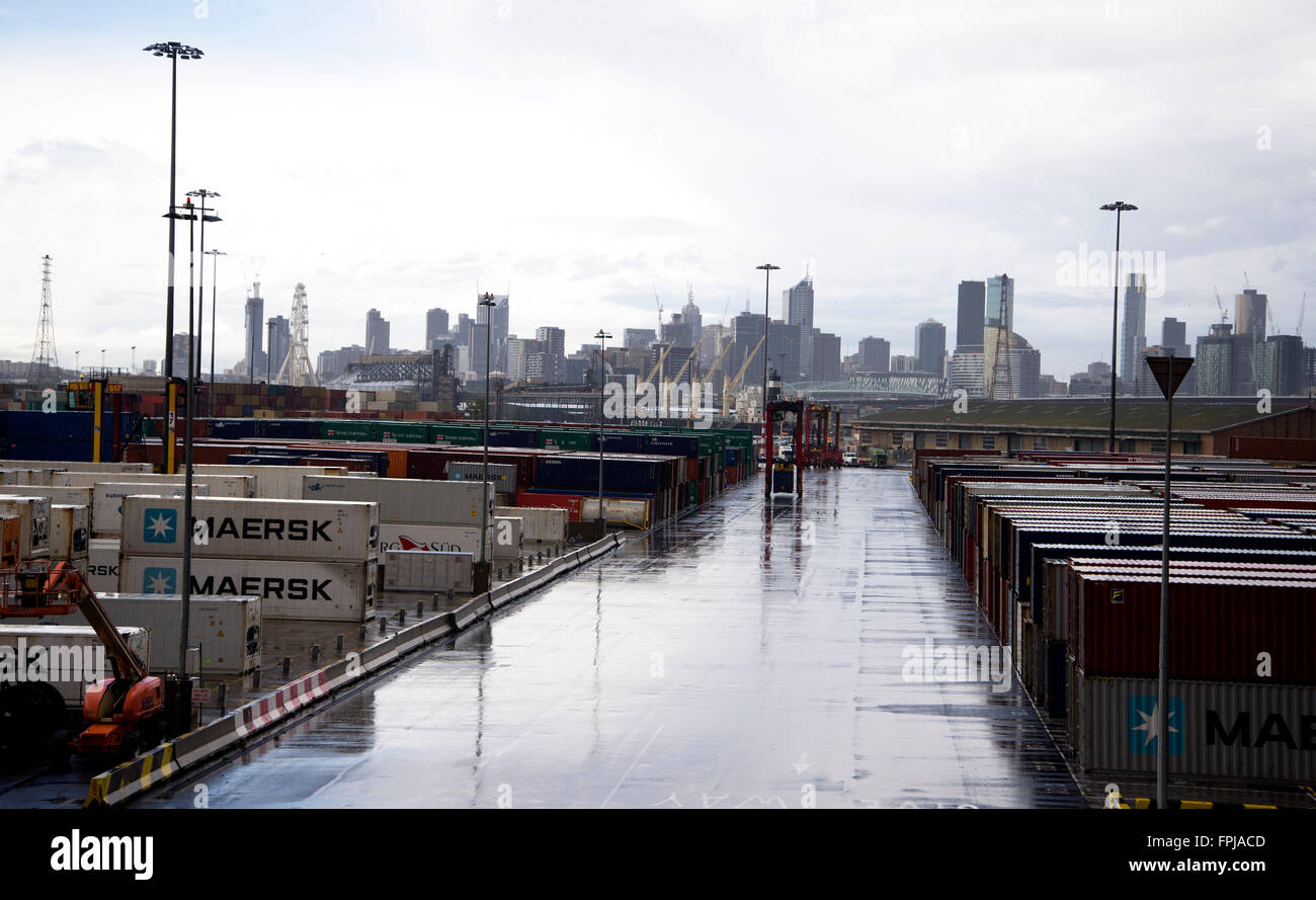 lines of containers stacked on a rainy wet day in Port of Melbourne ...