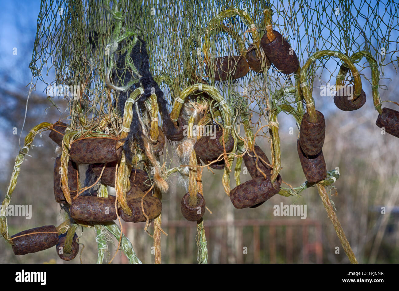 Fishing net hanging to dry Stock Photo - Alamy
