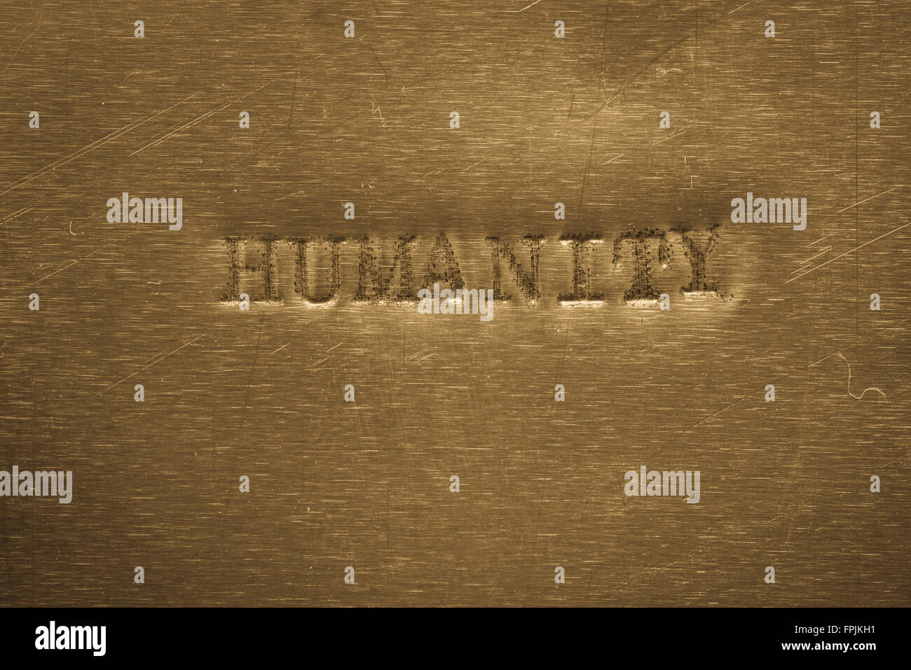 word humanity printed on golden metallic background Stock Photo - Alamy