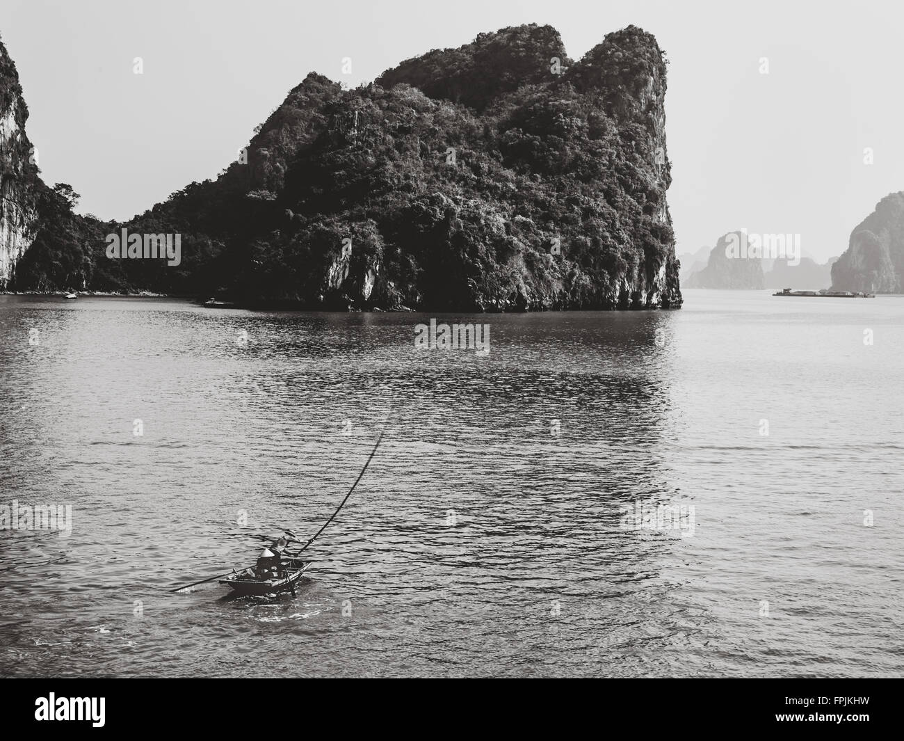 Vietnamese fishing in Halong Bay Stock Photo - Alamy