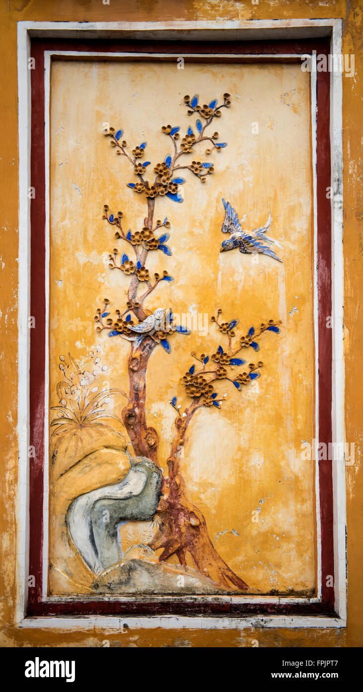 Panel relief painted yellow blue bird tree plant nature hi-res stock ...
