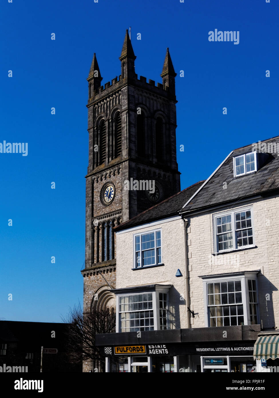 St Paul's Church dominates the High Street of Honiton, Devon, UK Stock ...